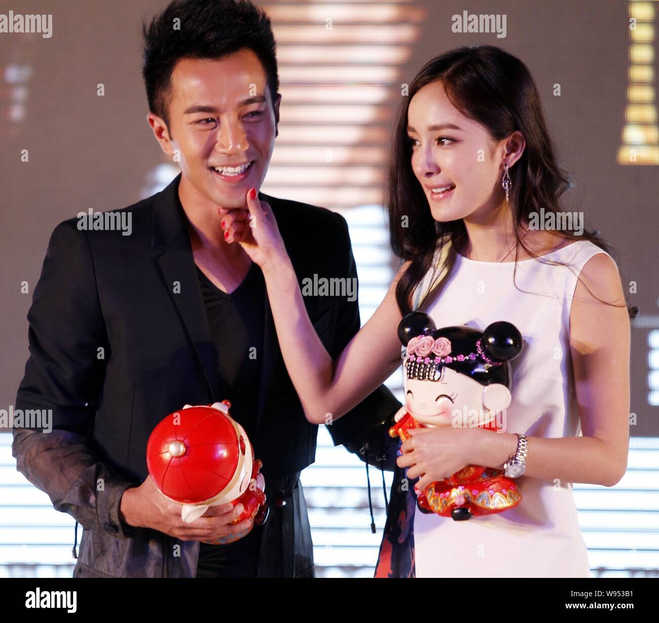 Hong Kong actor Hawick Lau and Chinese actress Yang Mi pose during the press conference for ...