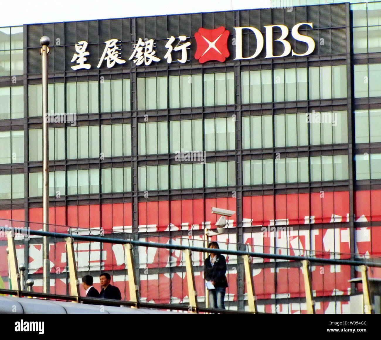 Pedestrians walk past dbs bank hi-res stock photography and images - Alamy