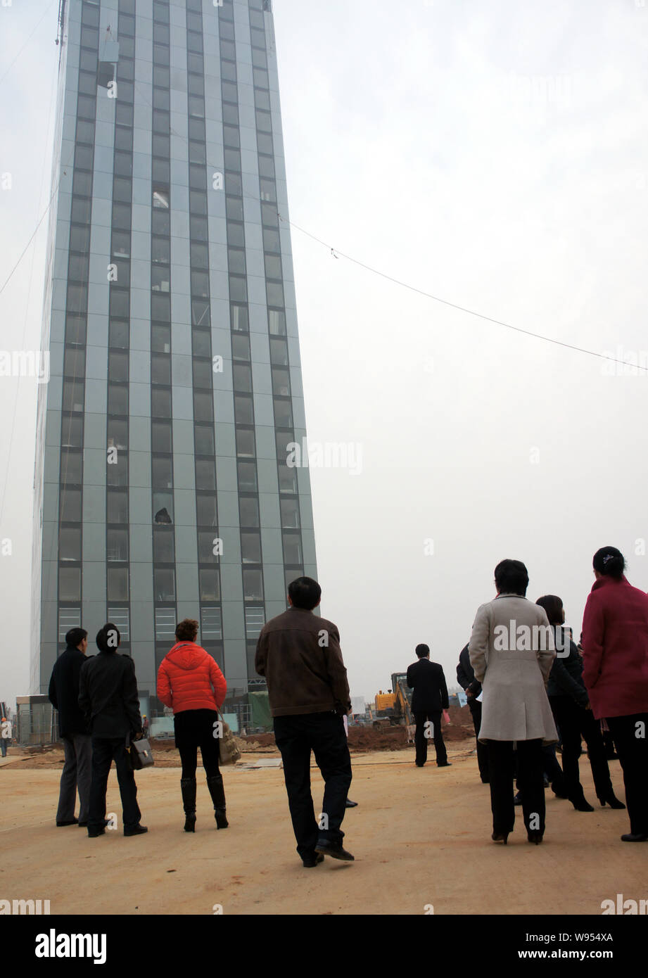 --FILE--Visitors look at the 30-storey New Ark Hotel which was built in ...