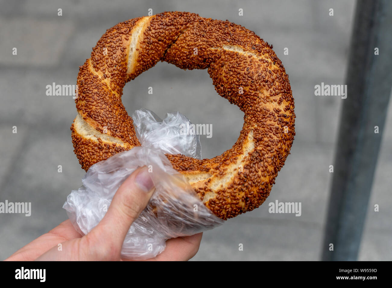Simit is a circular bread, typically encrusted with sesame seeds or ...