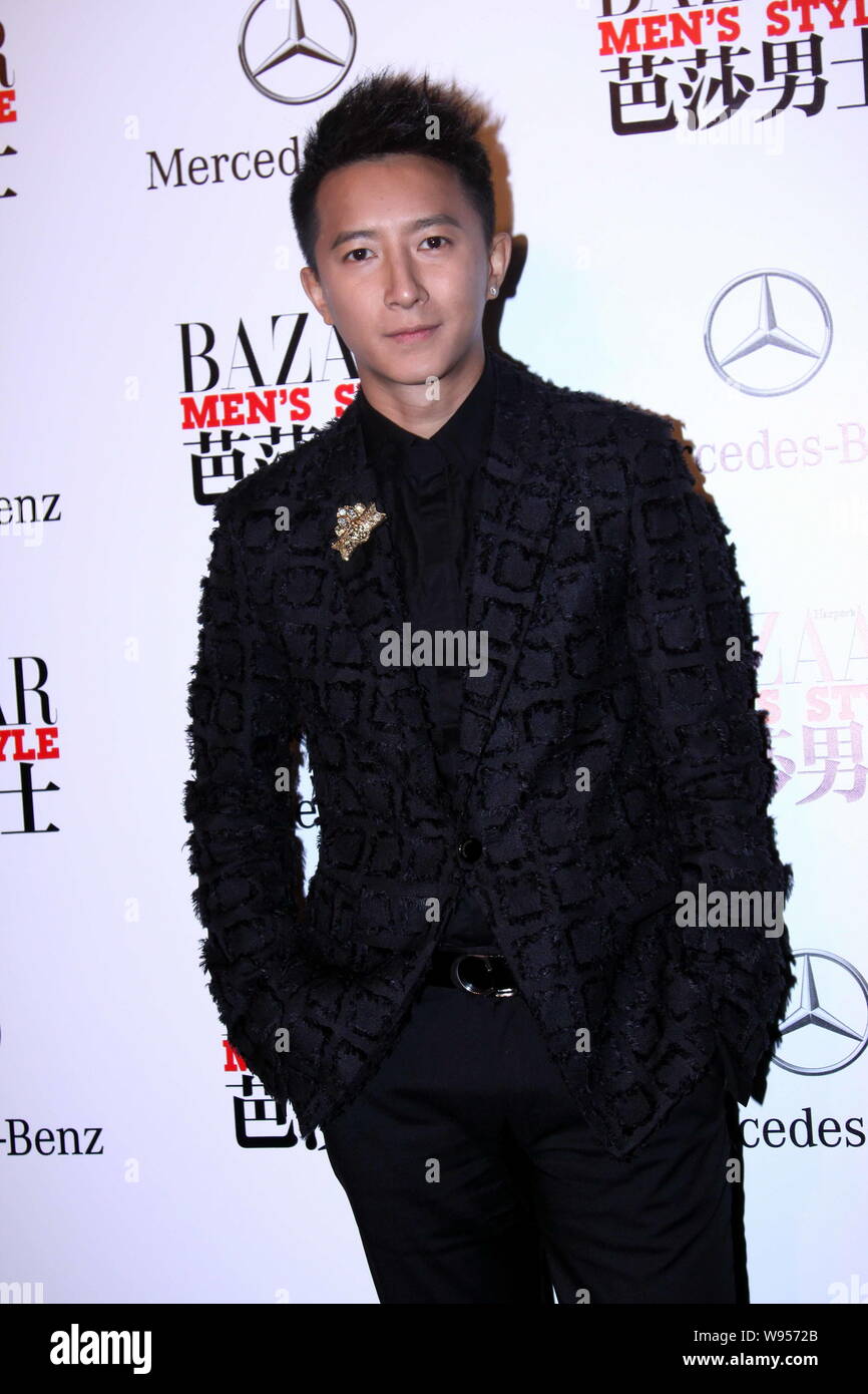 Chinese singer and actor Han Geng poses as he arrives for the award ...