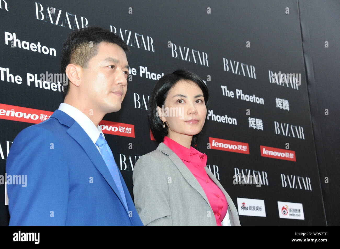 Hong Kong singer Faye Wong, right, and her actor husband Li Yapeng pose on the red carpet as ...