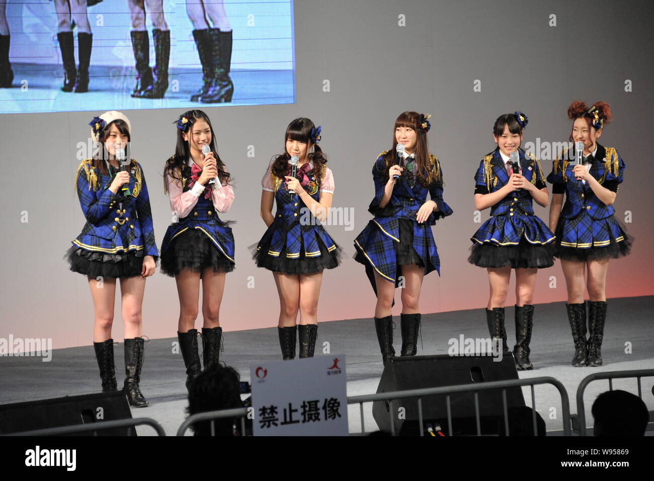 Members of Japanese female idol group AKB48 are pictured at their ...
