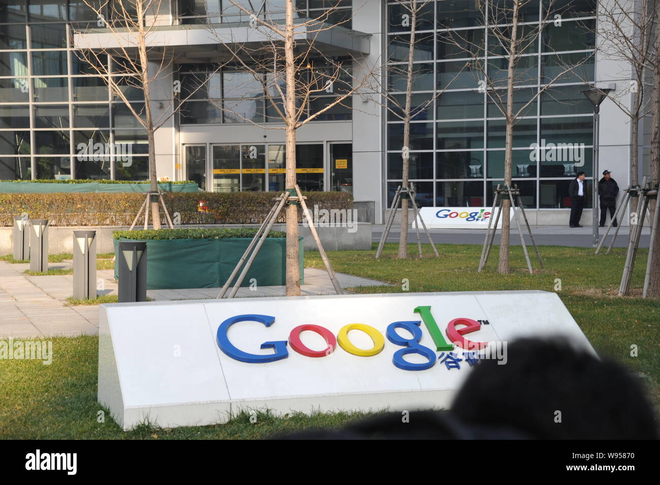 --File--Chinese men look on at the headquarters of Google China in ...