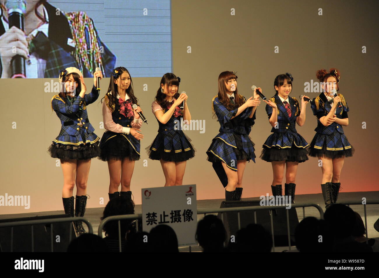 Members of Japanese female idol group AKB48 are pictured at their ...