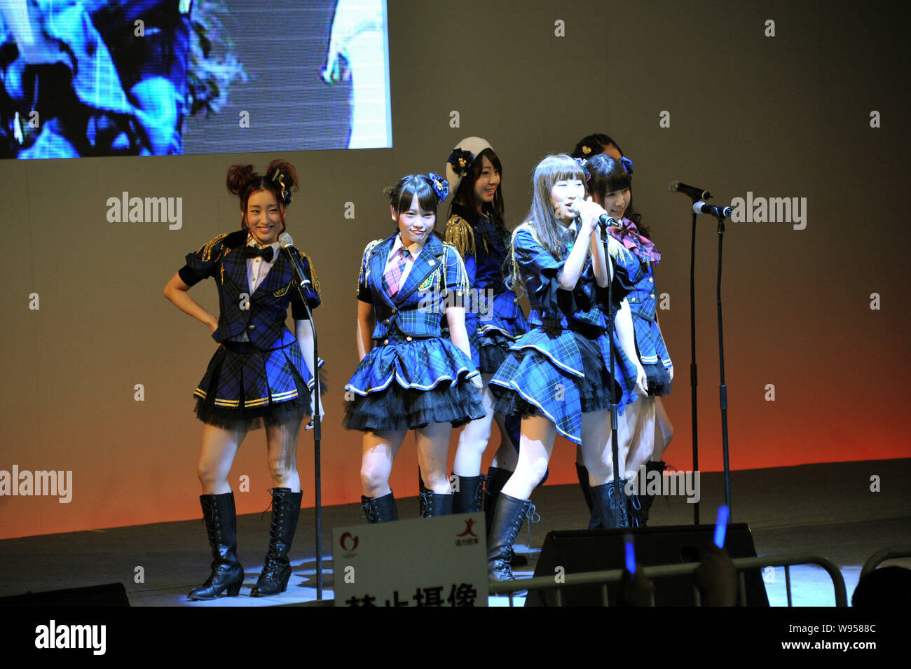 Members of Japanese female idol group AKB48 perform at their concert in ...