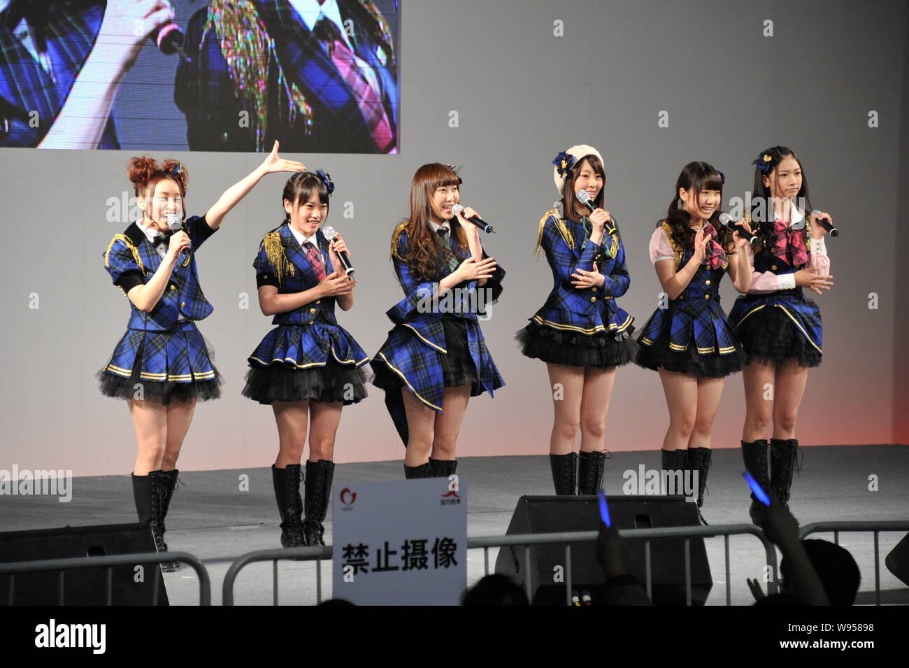 Members of Japanese female idol group AKB48 are pictured at their ...