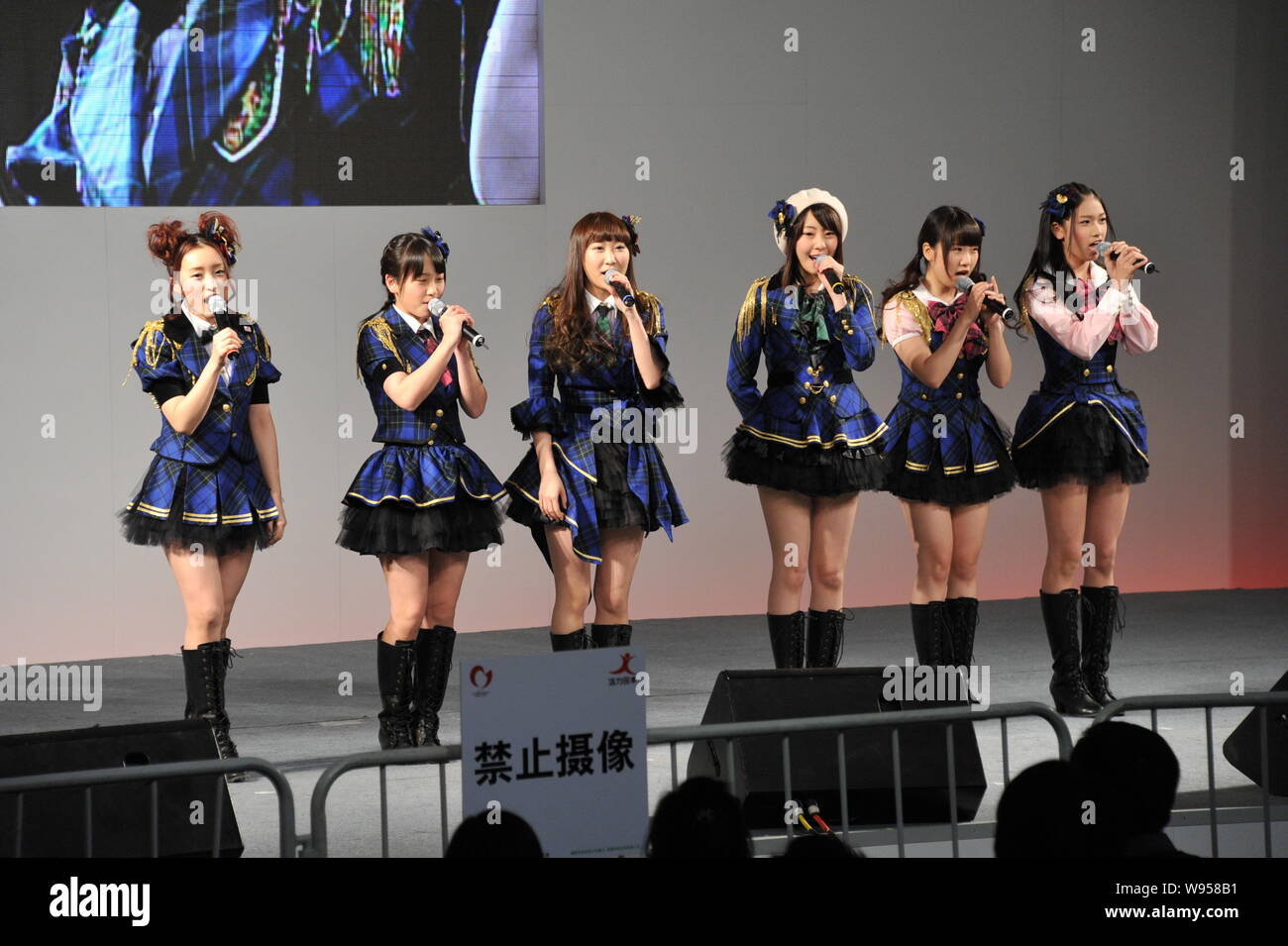 Members of Japanese female idol group AKB48 are pictured at their ...