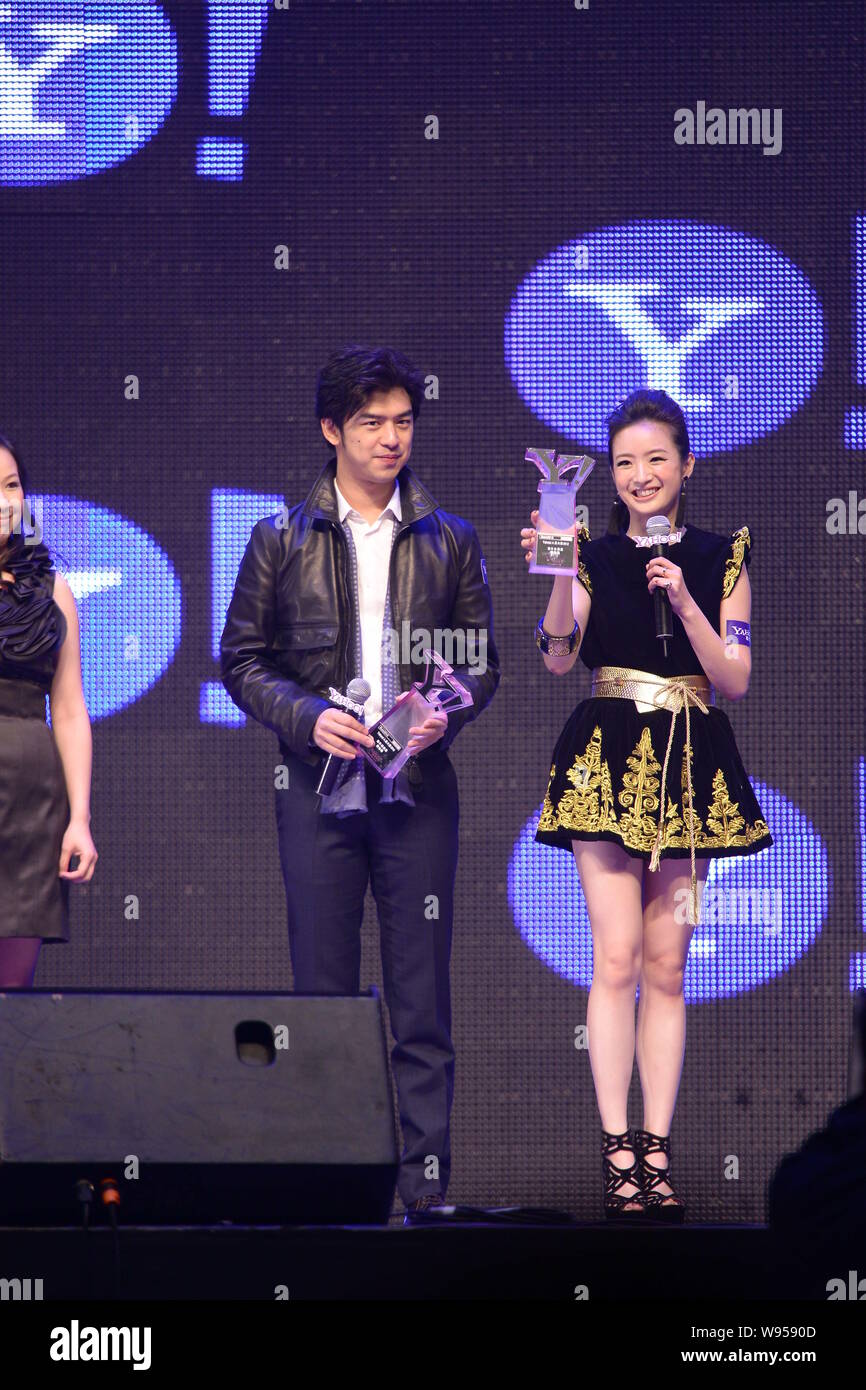 Taiwanese actor Berlin Chan (left), actress Ariel Lin show their awards ...