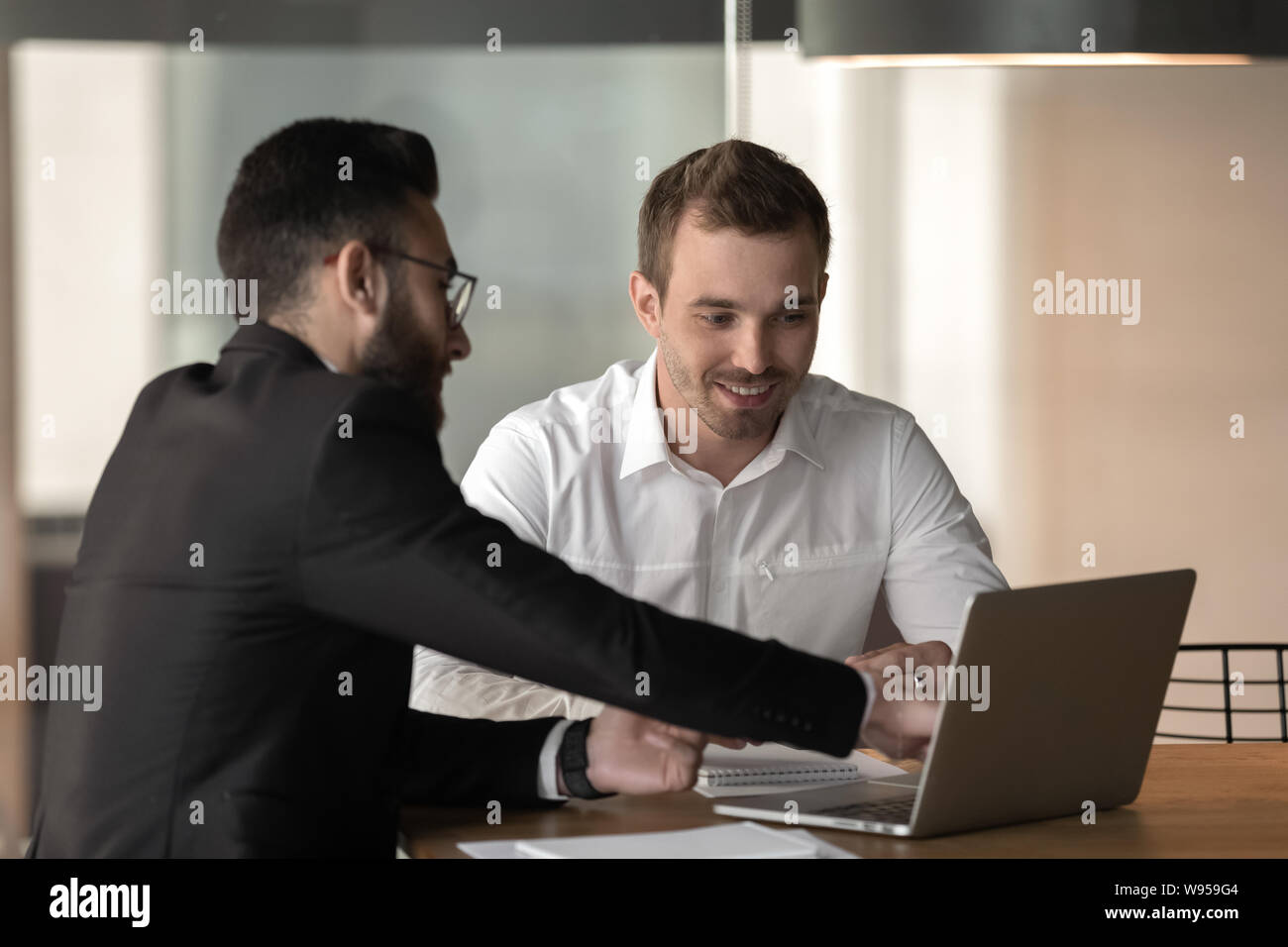Manager pointing at computer hi-res stock photography and images - Alamy