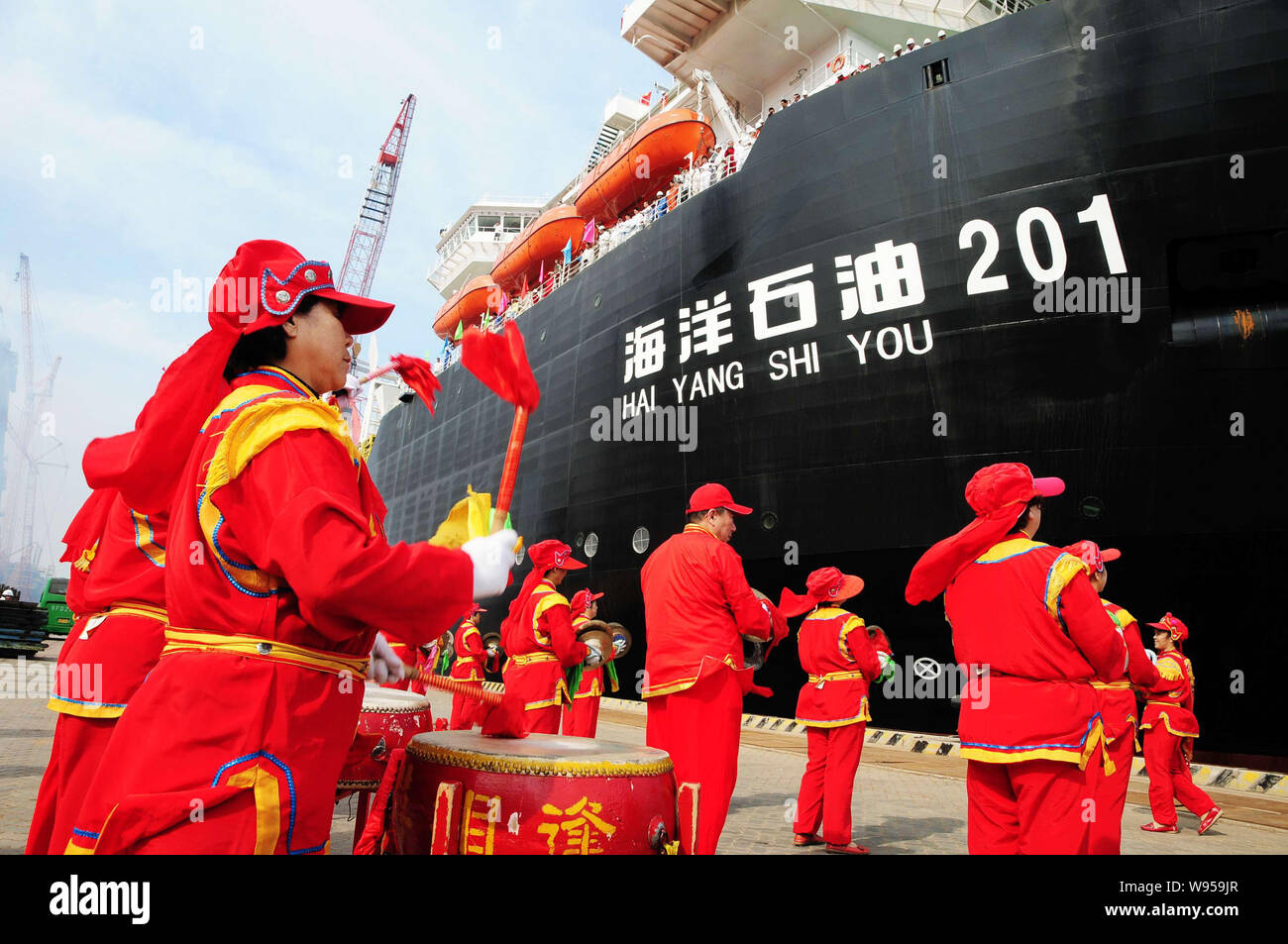 Chinese entertainers perform in front of the newly-built deepwater ...