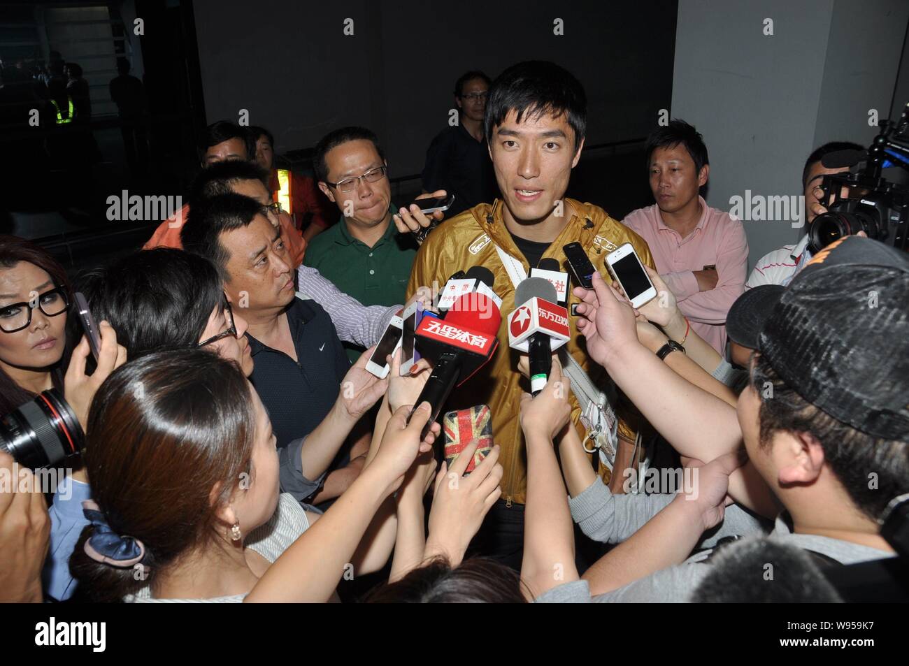 Chinese hurdler Liu Xiang is interviewed at the Shanghai Pudong ...