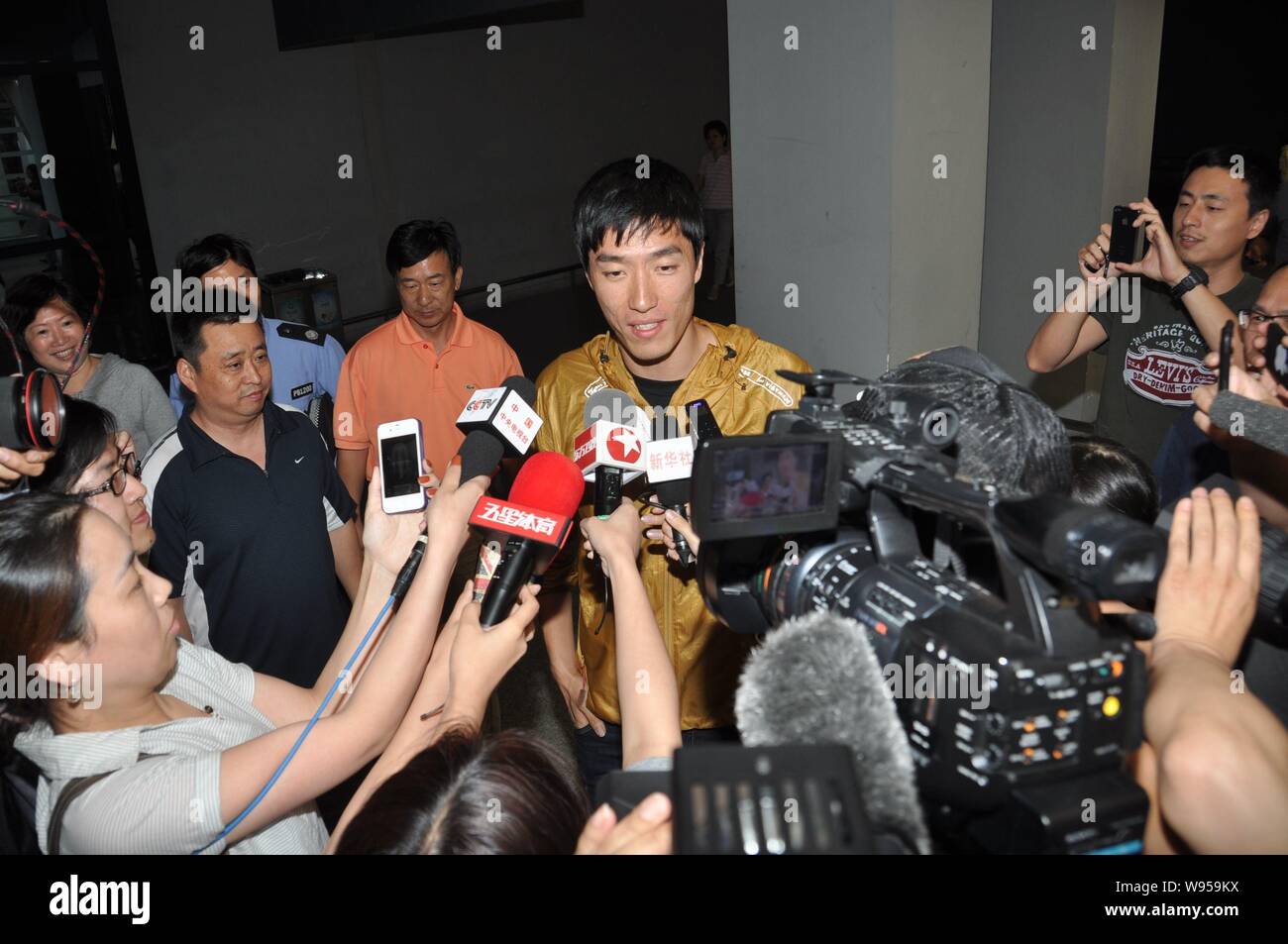 Chinese hurdler Liu Xiang is interviewed at the Shanghai Pudong ...