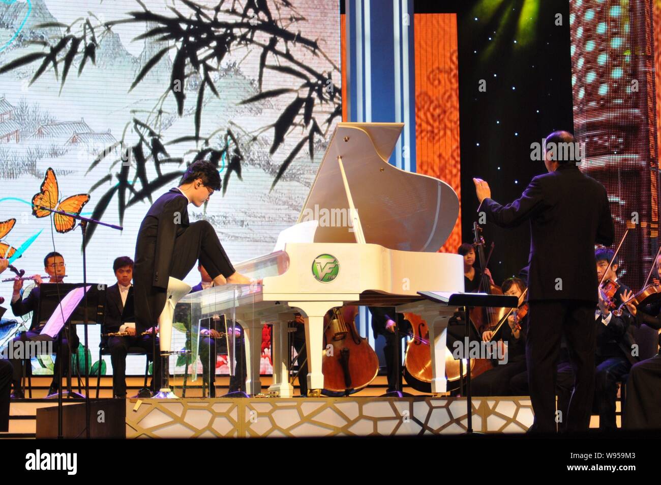 Chinese armless pianist Liu Wei performs during the opening ceremony of ...