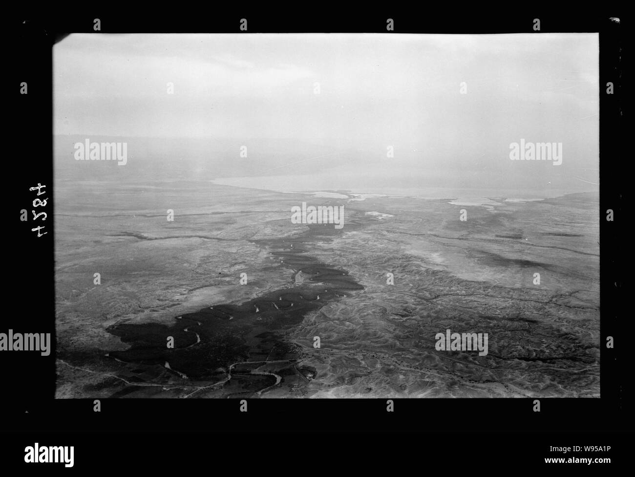 Air views of Palestine. Flying south over the Jordan Rift. Jordan River ...