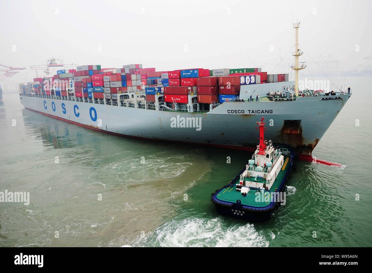 --File--A Cosco container ship is seen at a port in Qingdao city, east ...