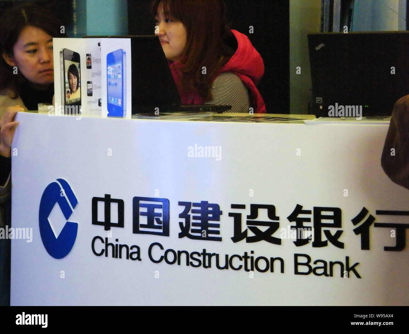 --File--Employees are pictured at the stand of China Construction Bank ...