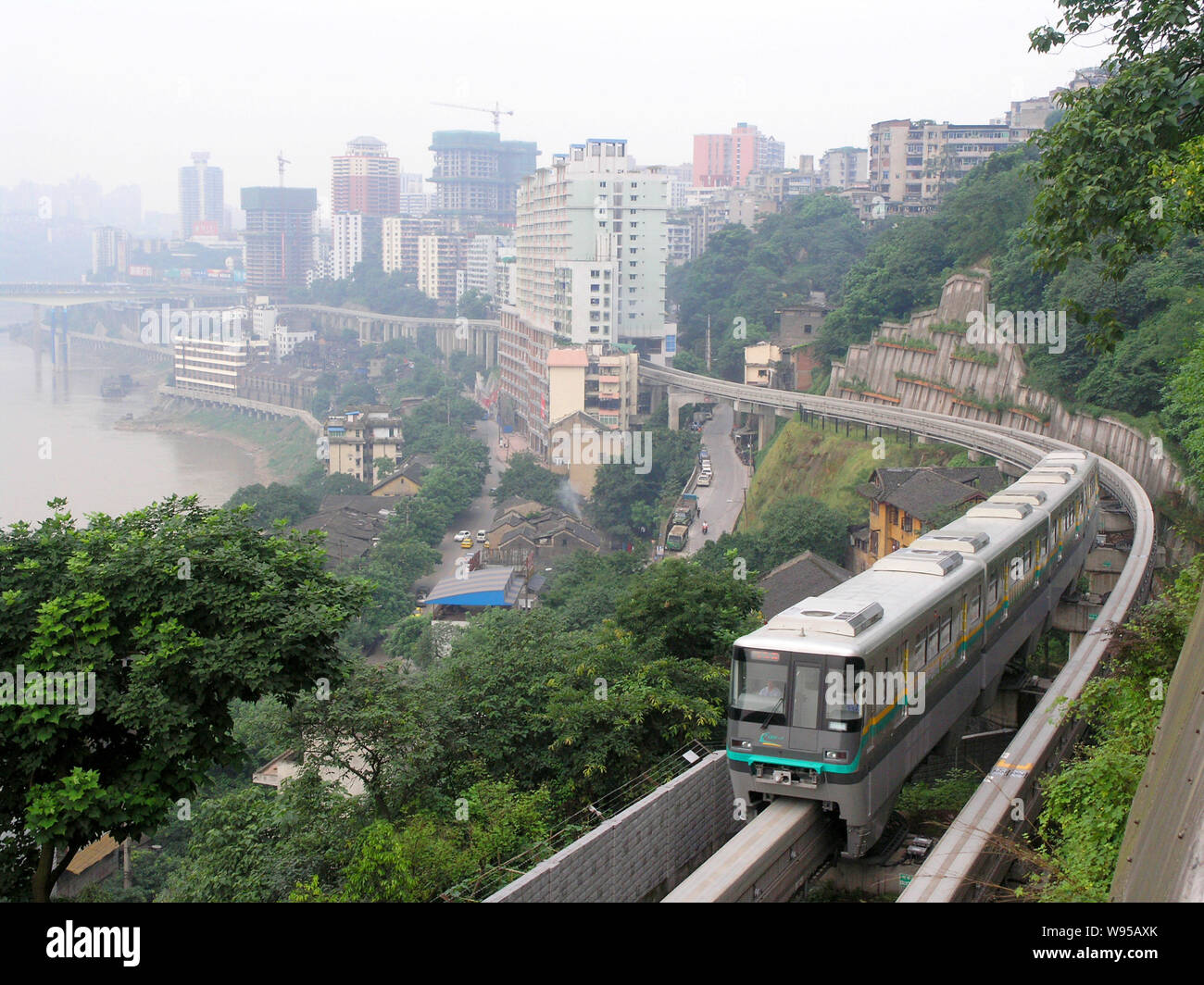 A monorail light train runs on the track in Chongqing, China, 19 June ...