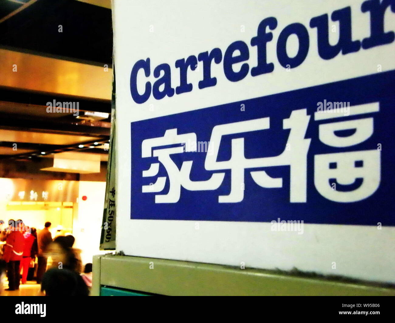 --File--A sign of Carrefour is seen at a Carrefour supermarket in ...