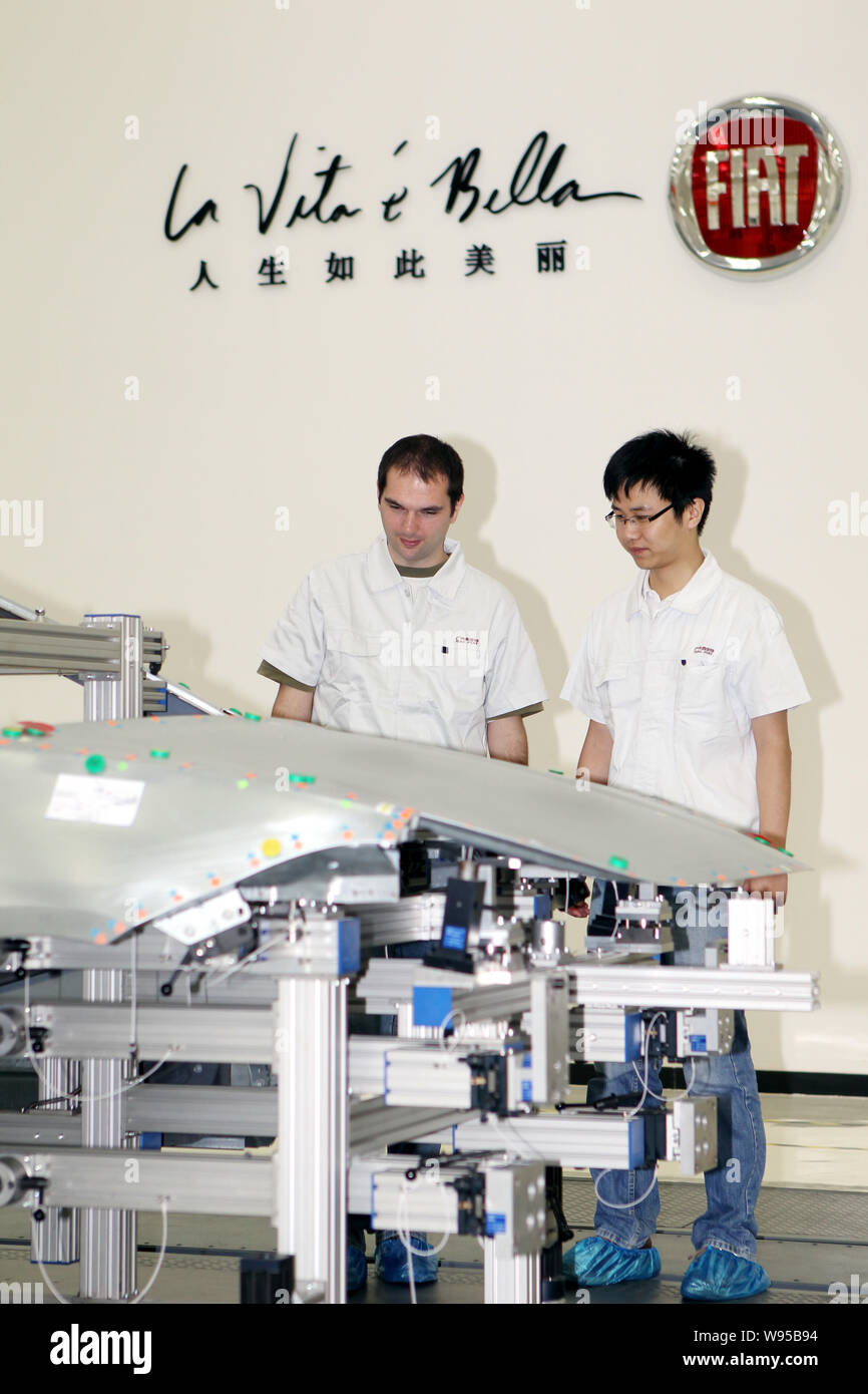 Engineers test auto parts at the GAC Fiat WCM plant in Changsha city ...