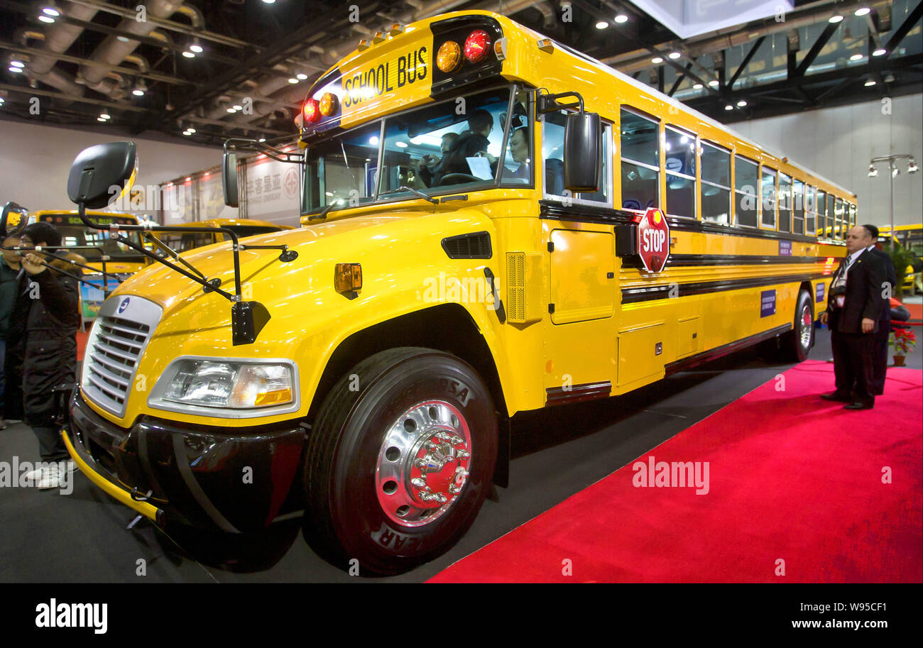 Visitors try out a Blue Bird school bus imported from the United States ...
