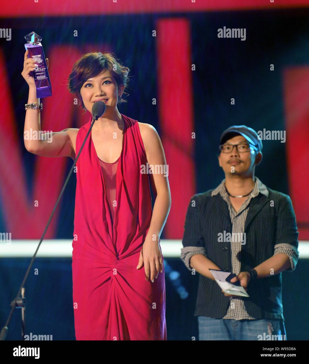 Malaysian singer Fish Leong speaks after being awarded the trophy for ...