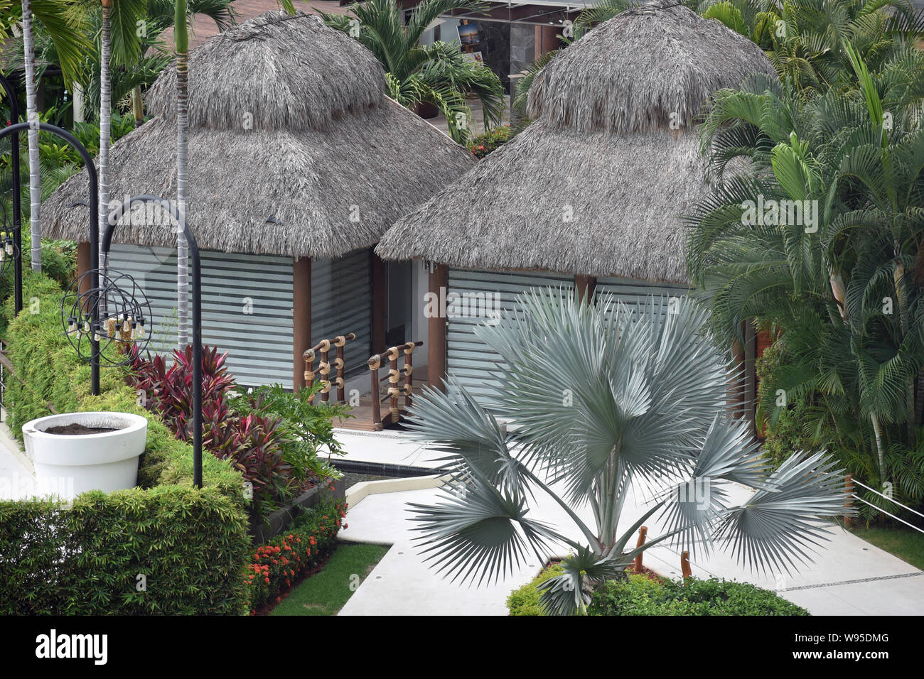 Glass Huts with Thatched Roofs Stock Photo - Alamy