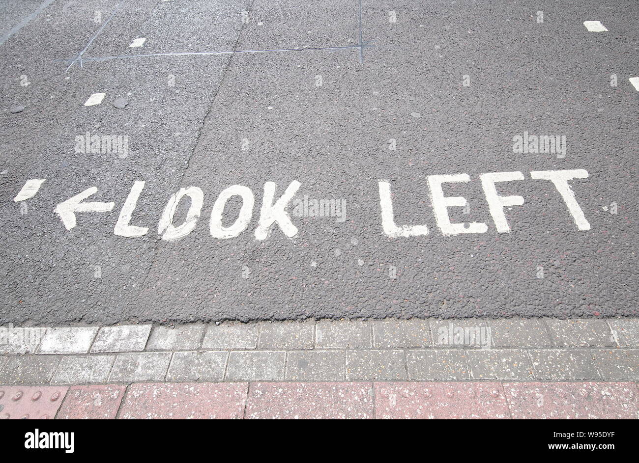 Look left sign pedestrian crossing London UK Stock Photo - Alamy