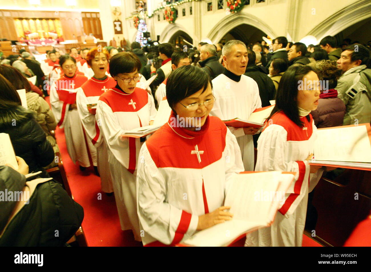 The choir performs during a Christmas eve service at Moore Memorial ...