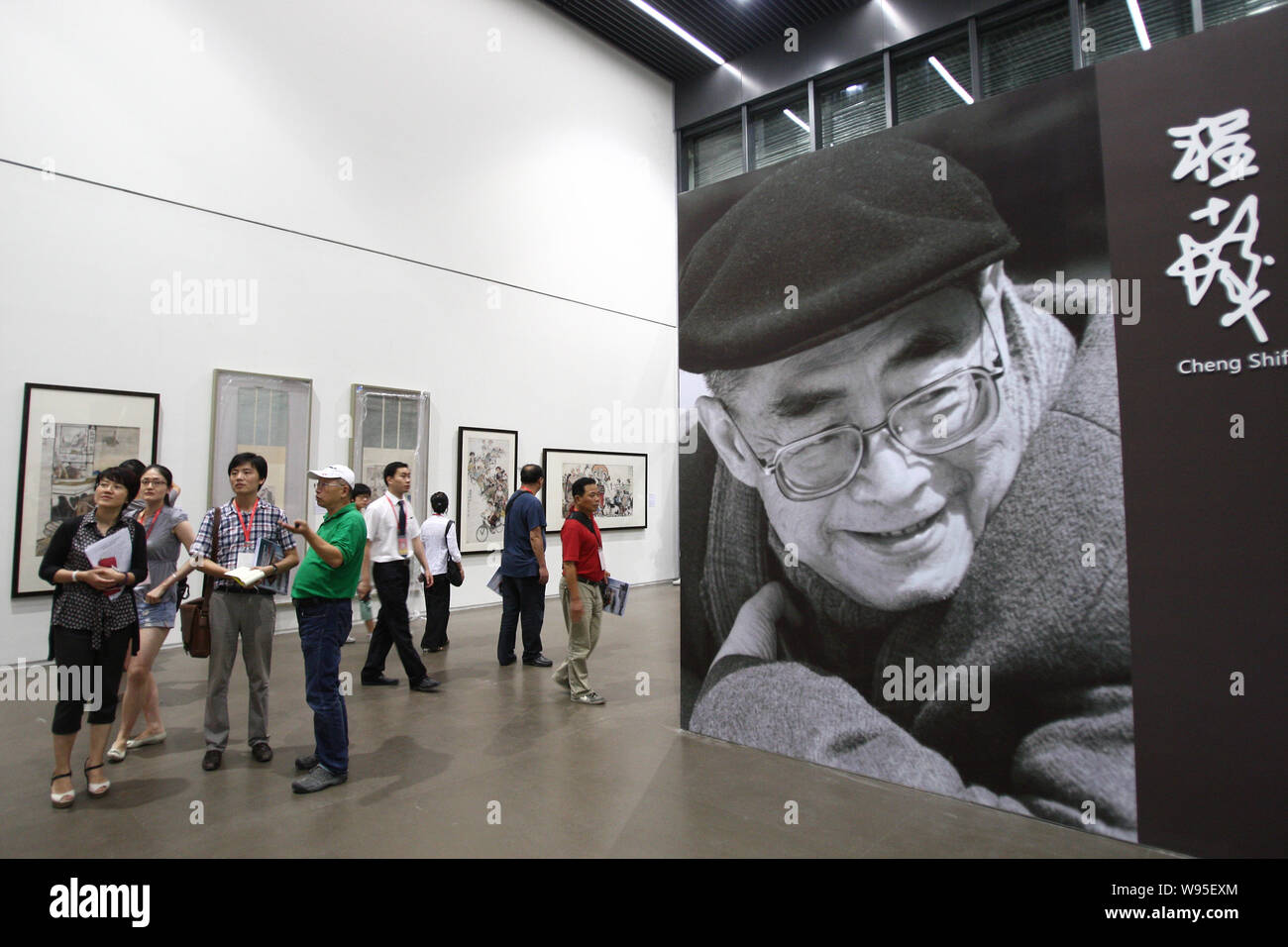 Visitors look at paintings made by Chinese calligrapher, painter and ...