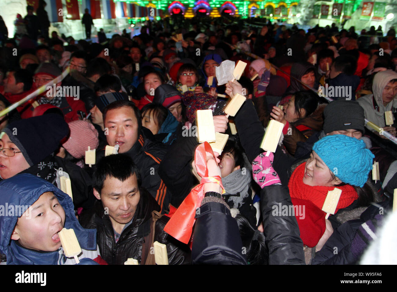 Tourists enjoy their popsicles during an event for creating a new ...