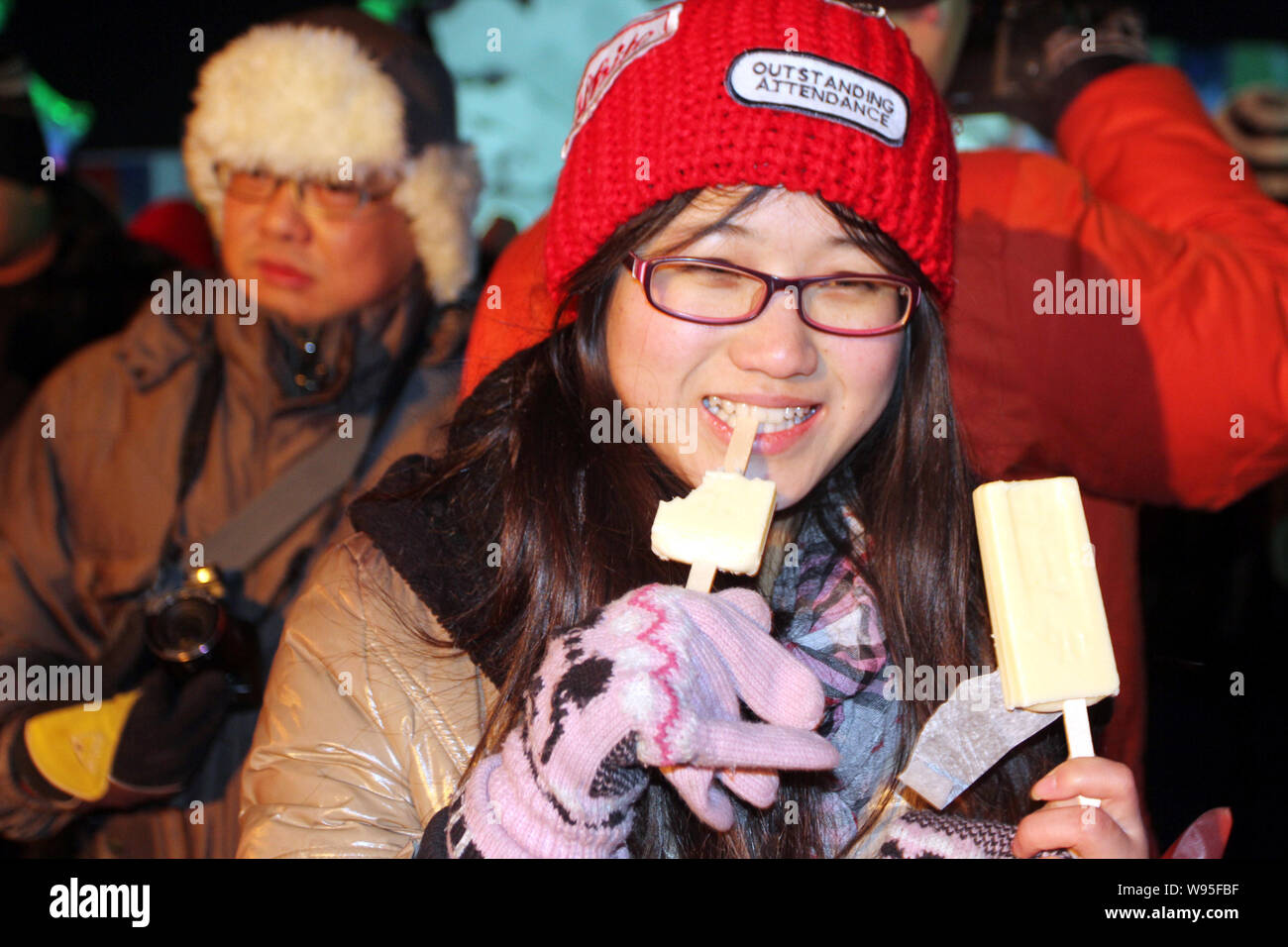 Tourists enjoy their popsicles during an event for creating a new ...