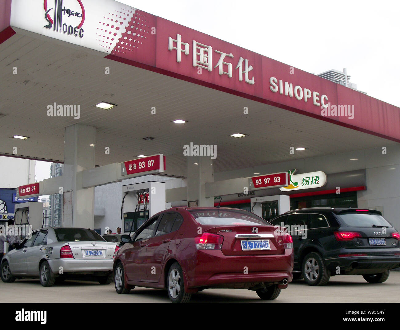 Cars to be refueled are lined up at a gas station of Sinopec in Nanjing ...