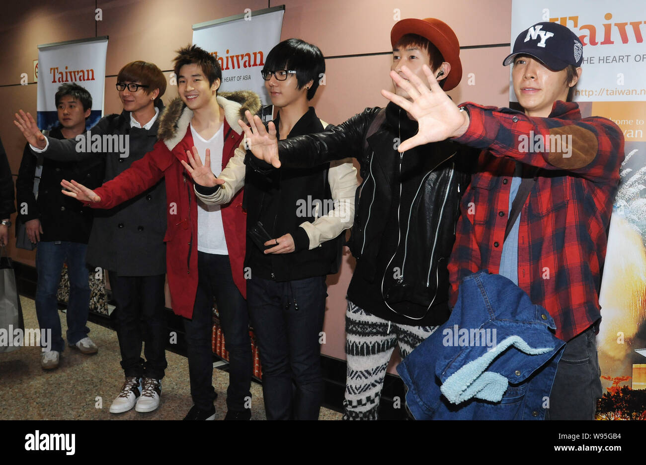 Members of South Korean band Super Junior wave to fans at Taiwan ...