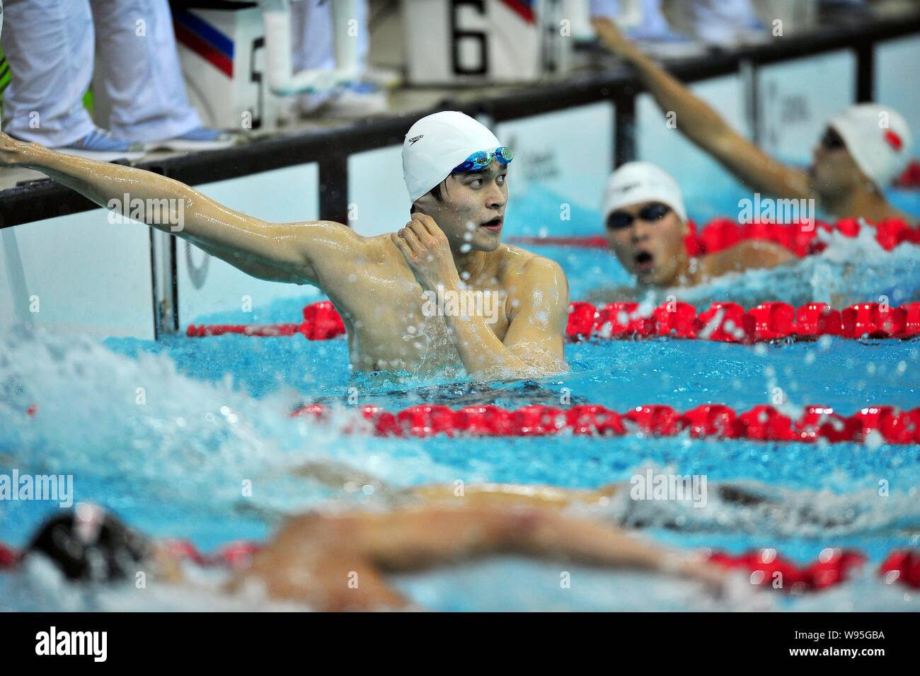 Chinese Olympic swimming champion Sun Yang, center, looks on in the ...
