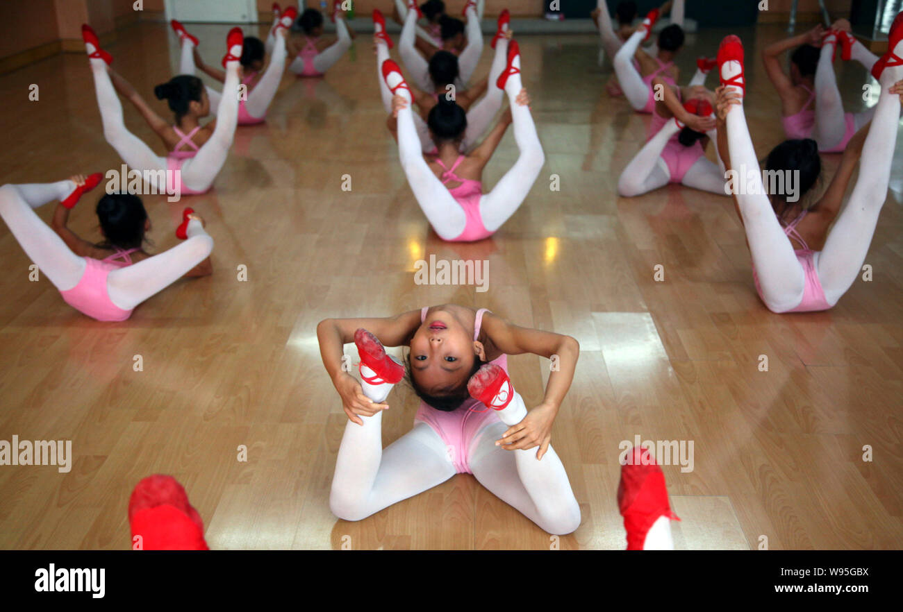 Young Chinese girls practice ballet at a dance training center in ...