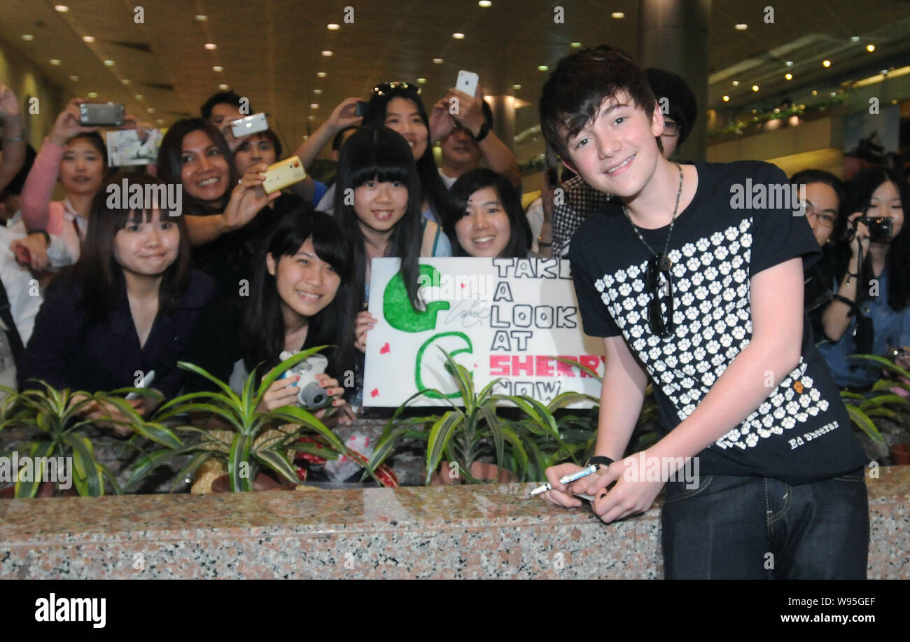American pop rock singer Greyson Chance is pictured with fans at an ...