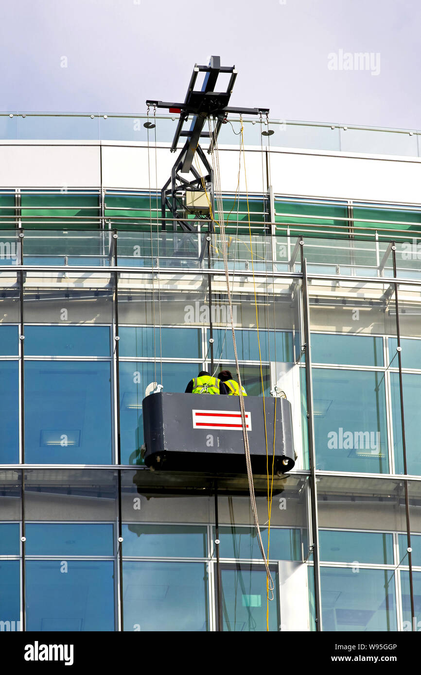 Window washers in elevator washing windows outside Stock Photo - Alamy