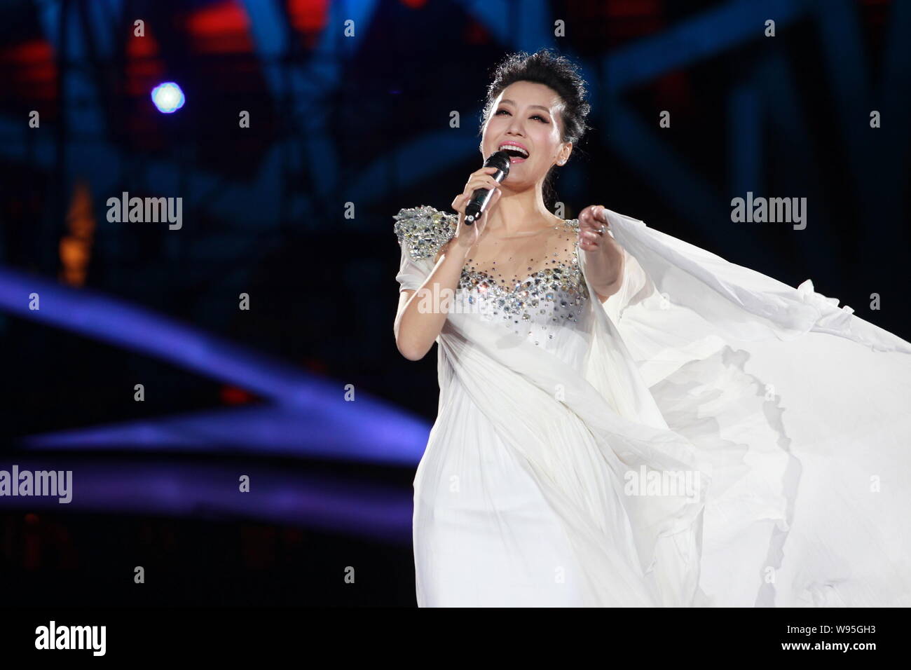 Chinese singer Tan Jing performs during a gala celebrating the triumph ...