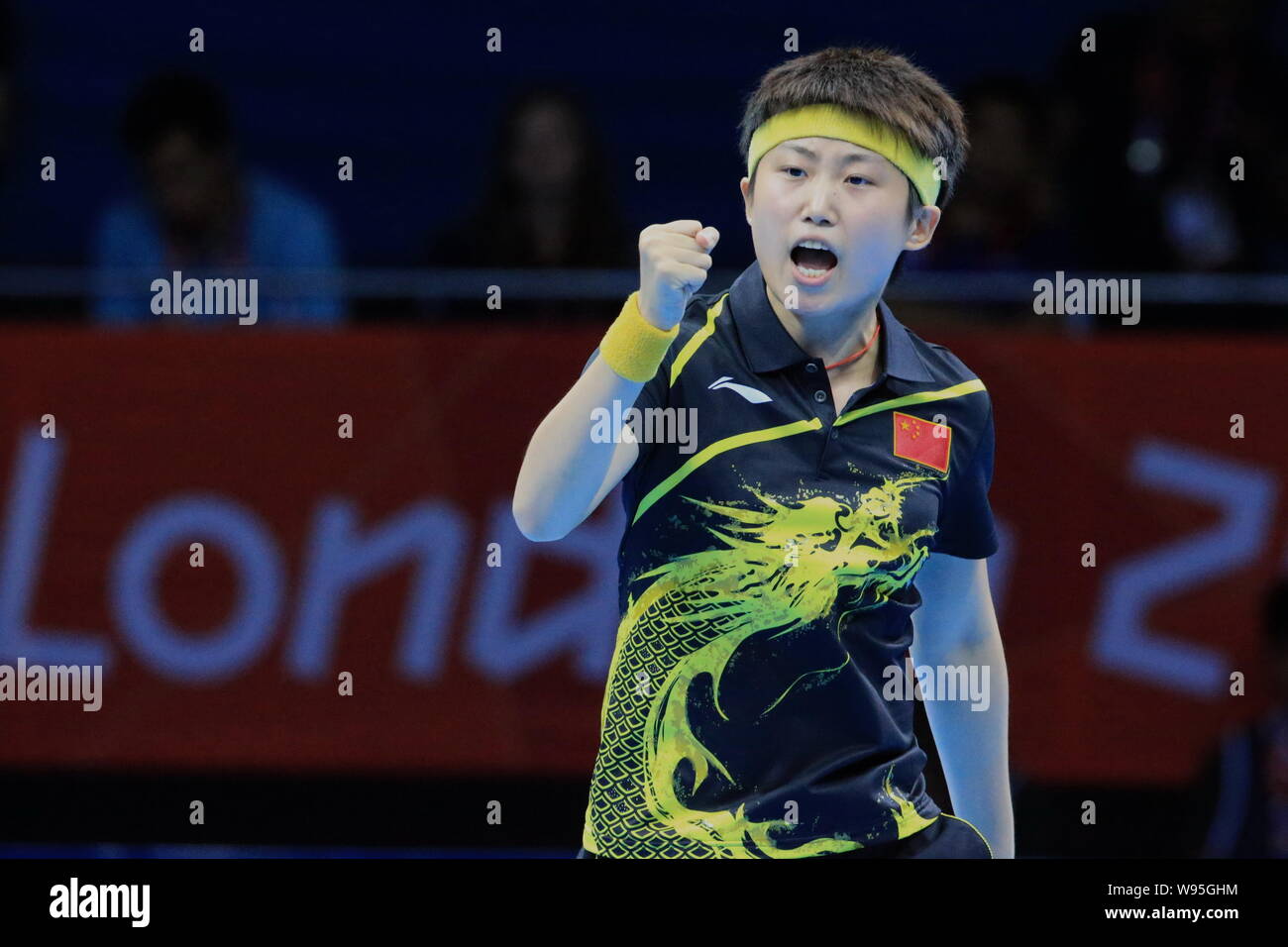 Chinas Guo Yue reacts while competing with her teammate Li Xiaoxia ...