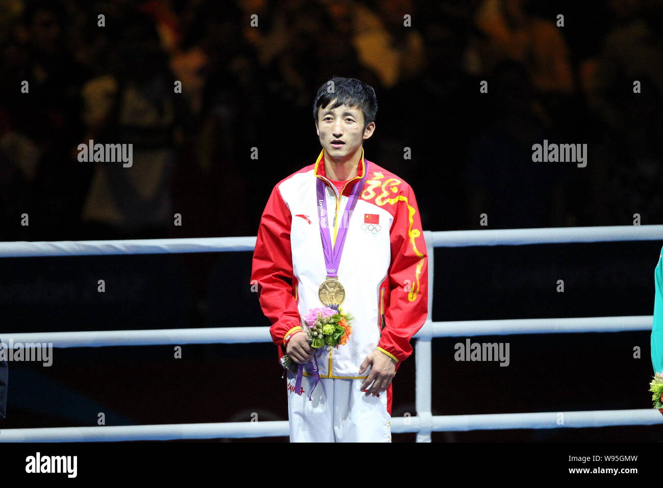 Gold medalist Zou Shiming of China poses in the award ceremony of the ...