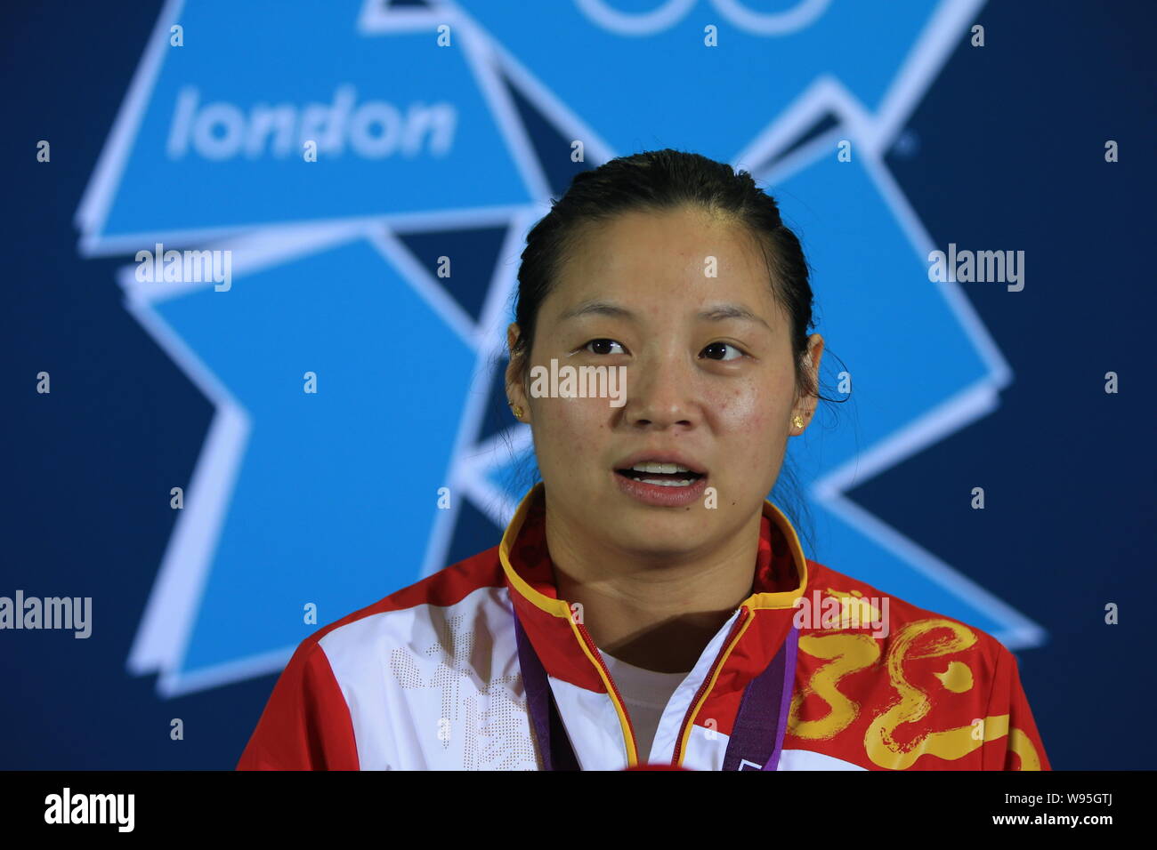 Gold medalist Li Yueying of China speaks at a press conference after ...