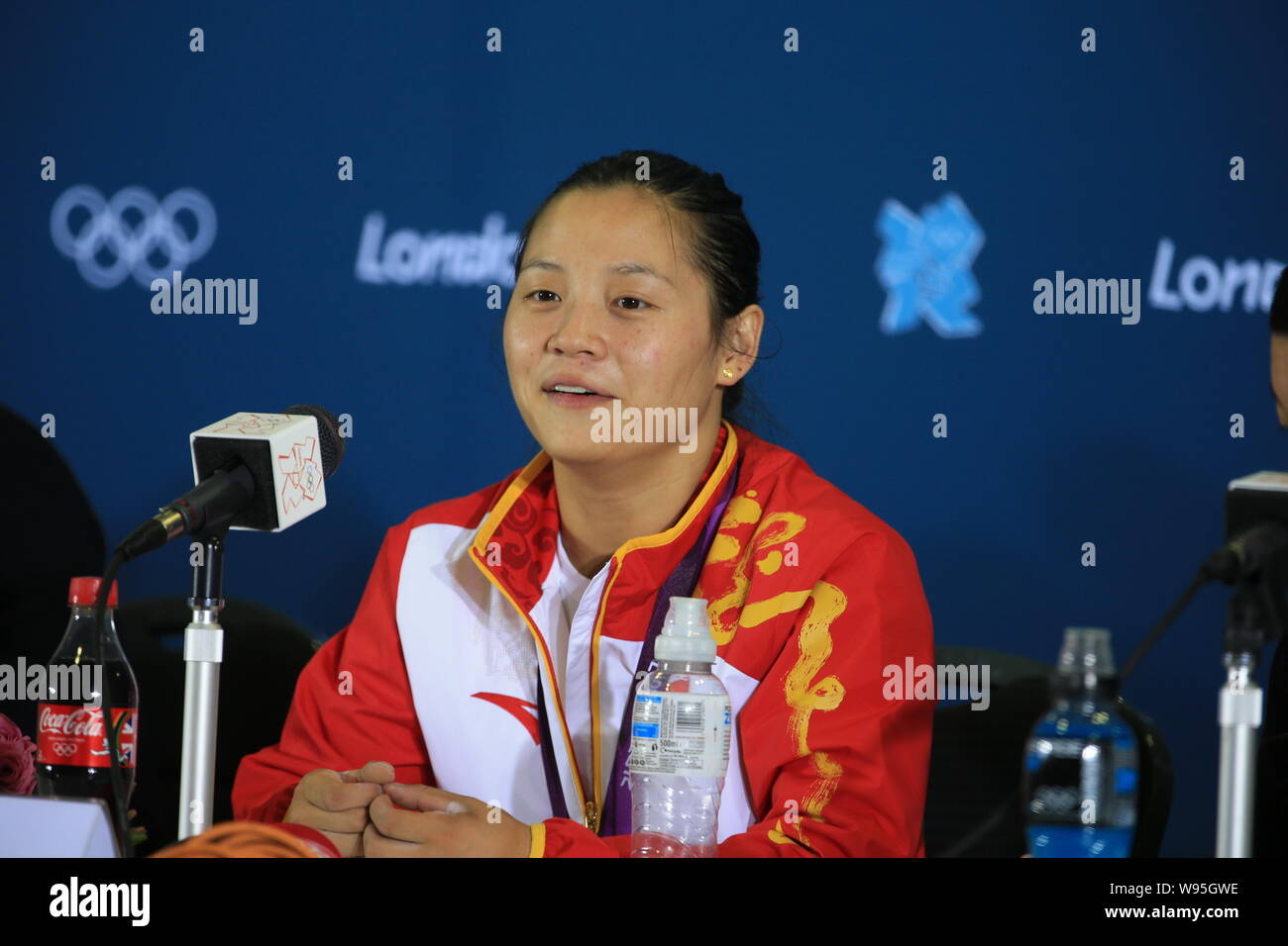 Gold medalist Li Yueying of China speaks at a press conference after ...