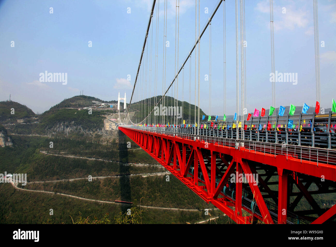 Visitors pass through Aizhai Suspension Bridge in Aizhai town, Jishou ...