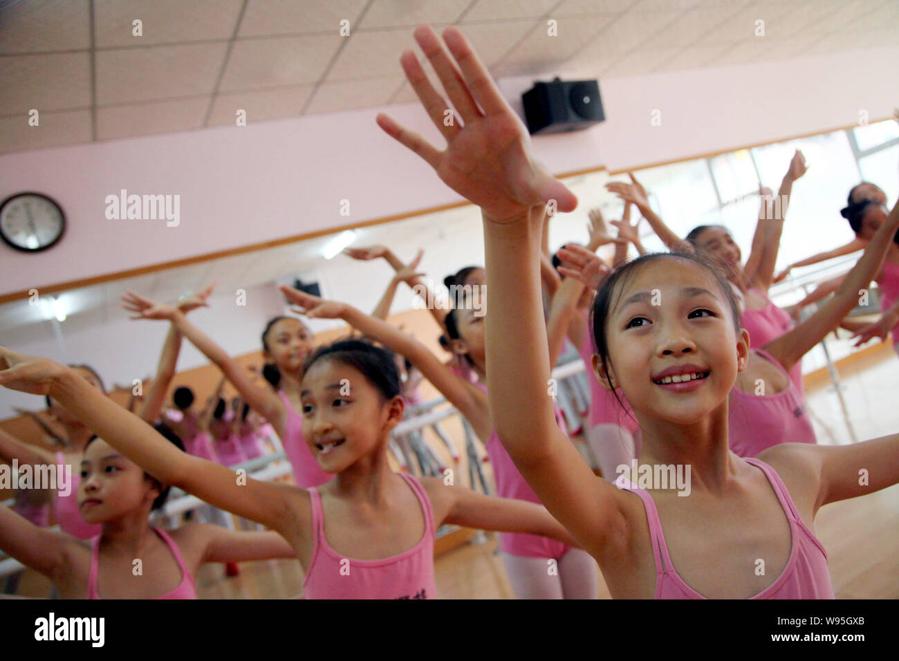 Young Chinese girls practice ballet at a dance training center in ...