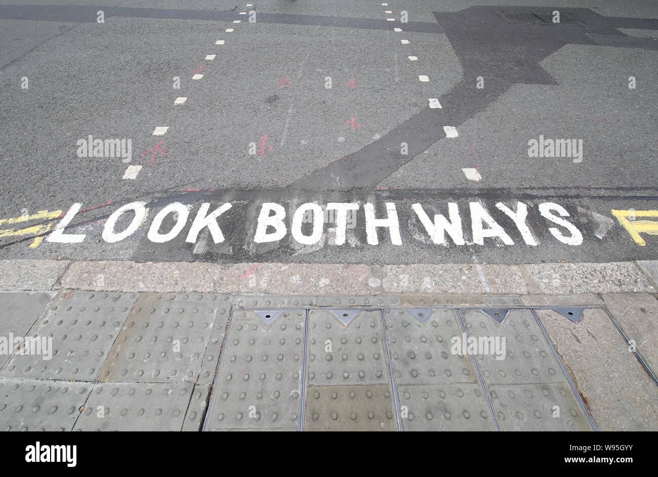 Look both ways sign pedestrian crossing London UK Stock Photo - Alamy