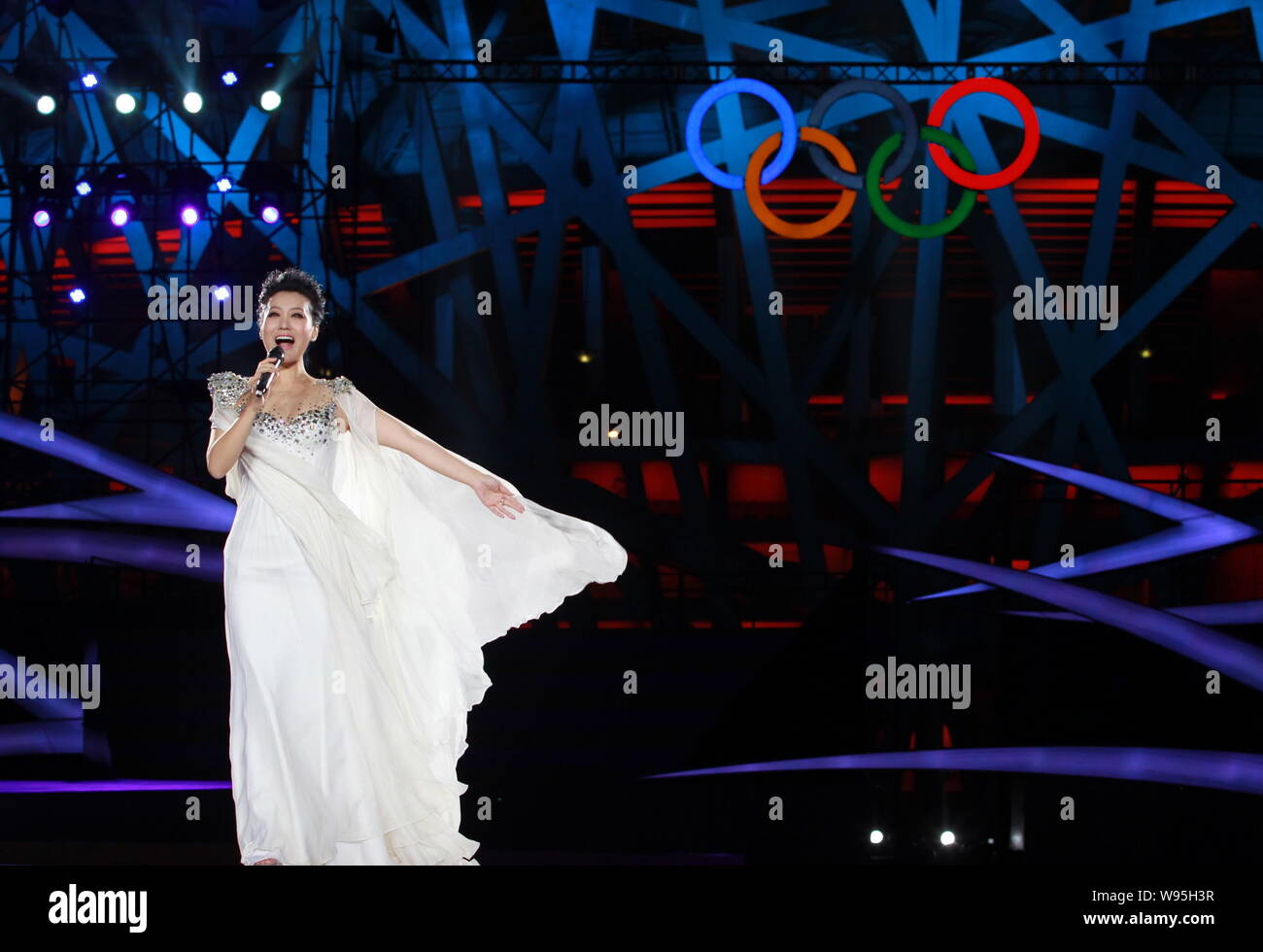 Chinese singer Tan Jing performs during a gala celebrating the triumph ...