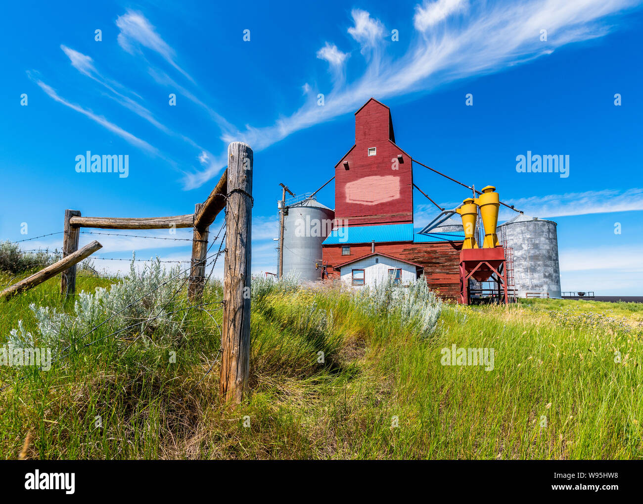 The historic Cadillac grain elevator in Saskatchewan, Canada with fence ...