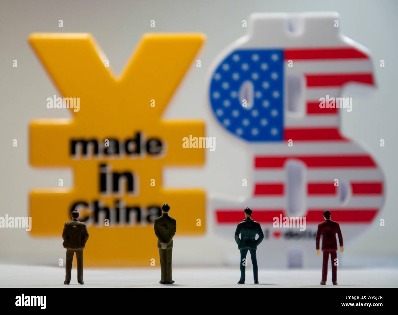 Models of Chinas RMB sign and US dollar sign, Shaoyang, central Chinas ...