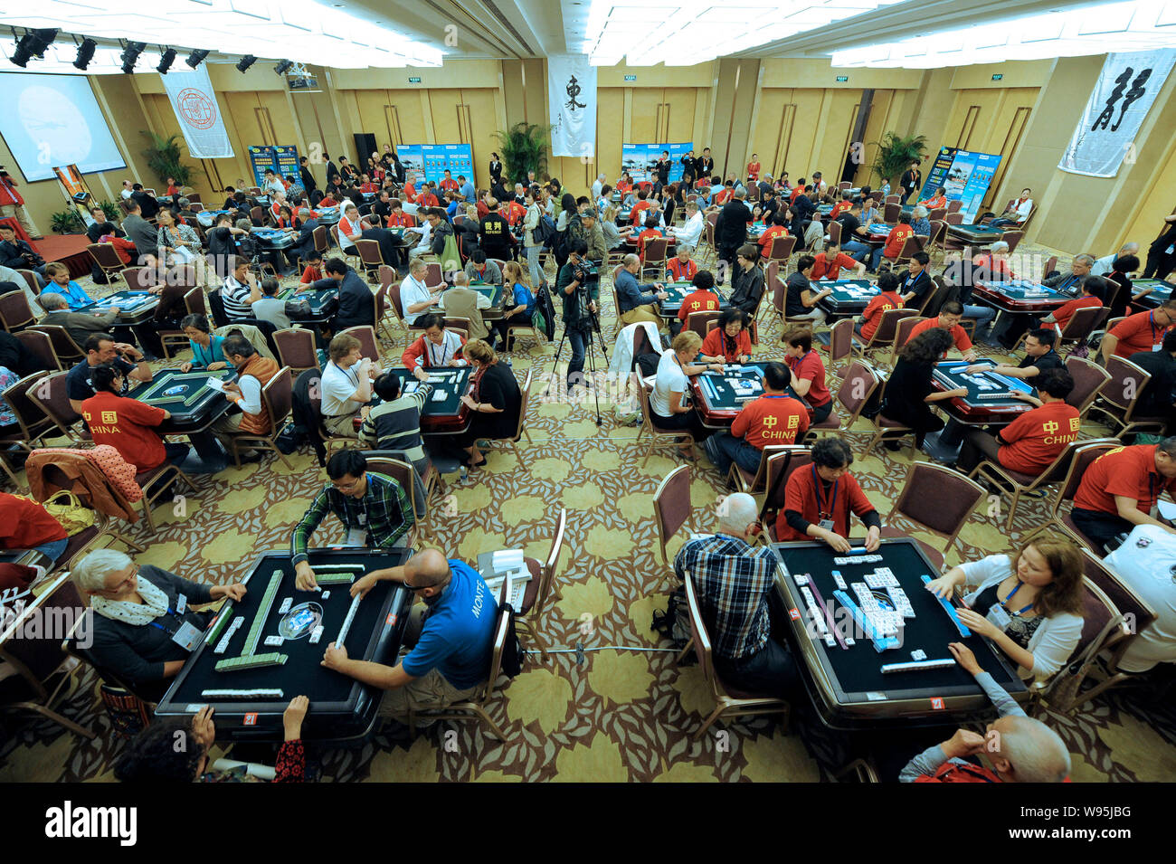 Participants compete during the 3rd World Mahjong Championship in ...